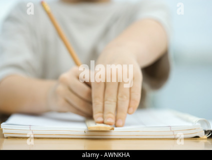 Child draws a line in pencil with a wooden ruler Stock Photo - Alamy