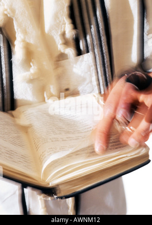 Close up of Jewish man's hand, wearing Tefillin, with Torah Stock Photo ...