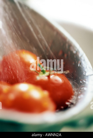 Cleaning tomatoes, close-up Stock Photo - Alamy