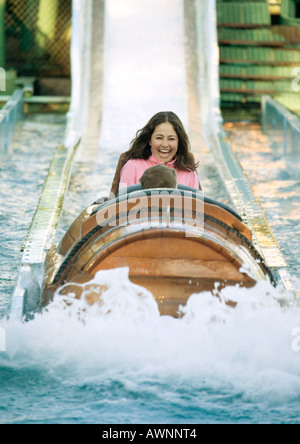 log flume water ride at the fun fair man and child on the ride Stock ...