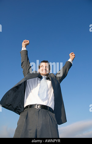 An elated businessman Stock Photo - Alamy