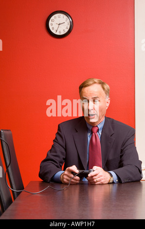 Businessman playing video games Stock Photo - Alamy