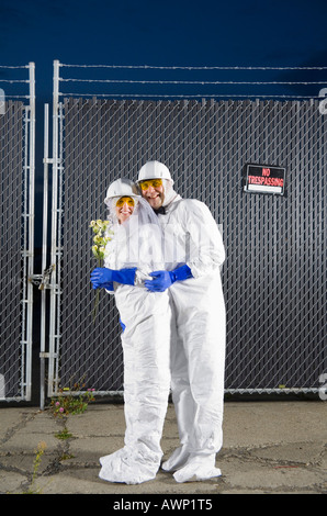 People in biohazard suits standing outside security gate Stock Photo ...