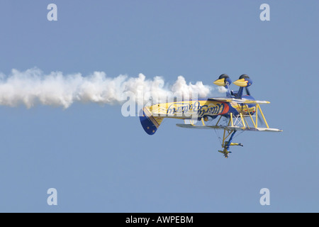A Boeing PT17 Stearman biplane displaying with a wing walker between ...