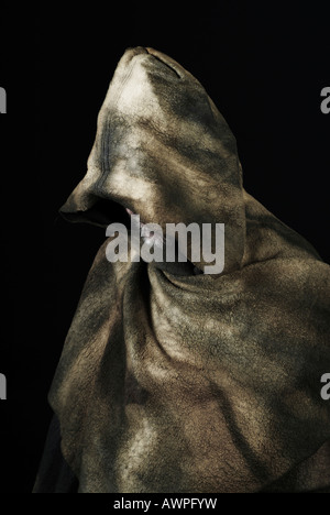 Hooded monk wearing cloak Stock Photo - Alamy