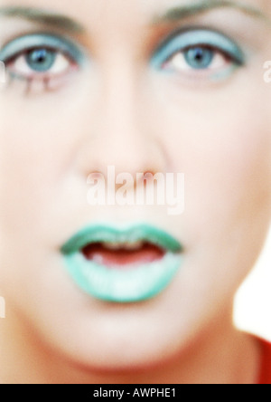 Front view portrait of a perplexed woman checking phone surprising news in the street Stock ...