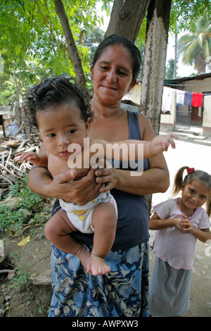 HONDURAS Woman with children The slum barrio of Chamelecon San Pedro ...