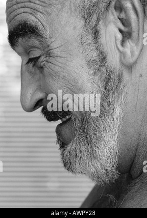 cropped view of bearded senior man reading book at home Stock Photo - Alamy