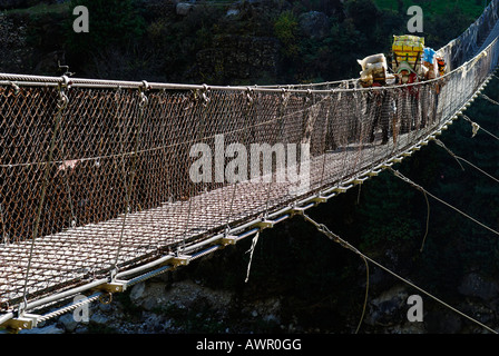 Suspension bridge made of steel, Hillary Bridge, over Dudh Koshi river ...