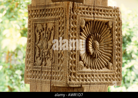 wood carving on supporting temple posts Embekke Devale Stock Photo - Alamy