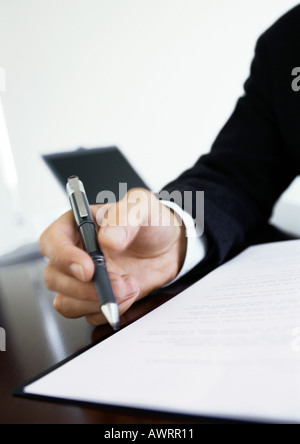 Image of a businessman hand signing documents Stock Photo - Alamy
