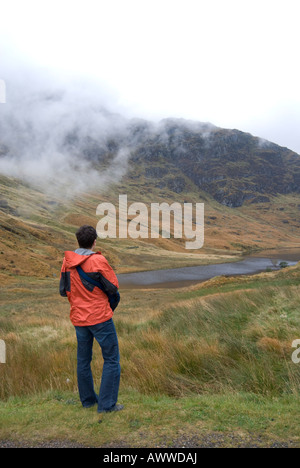 A young woman tourist at Rest and be Thankful, rest stop in Scotland ...