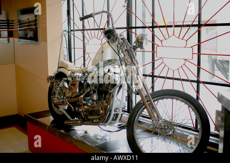 Mororcycle in the store display window Stock Photo - Alamy