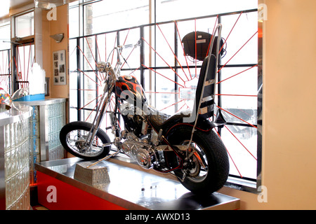 Mororcycle in the store display window Stock Photo - Alamy