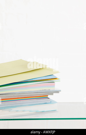 Stack of coloured stationery, studio shot Stock Photo - Alamy