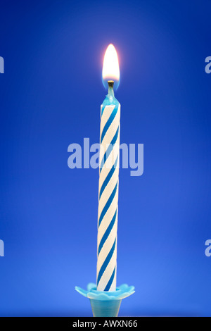 Number 5 blue celebration candle on white wooden background. Happy ...