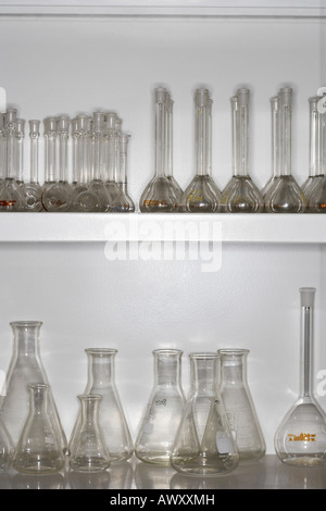 Laboratory flasks on shelves Stock Photo - Alamy