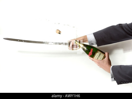 traditional sabrage ritual of a champagne bottle by a saber with a ...