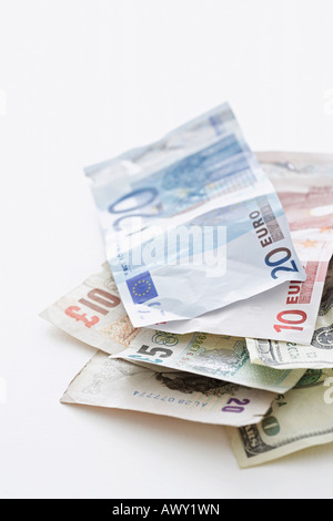 British paper money crumpled up in a ball. Banknotes on white ...