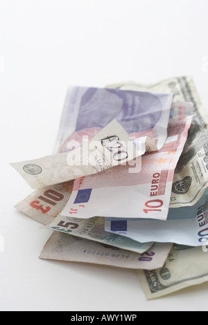 British paper money crumpled up in a ball. Banknotes on white ...