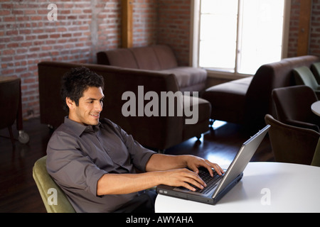 Joyful Black Guy Using Laptop Gesturing Yes Holding Paper Indoors Stock ...