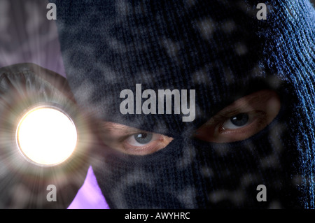 bank robber with ski mask and flashlight in bank vault Stock Photo - Alamy