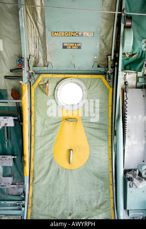 Emergency exit only yellow door sign Stock Photo - Alamy