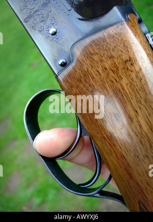 Finger on the trigger of a shotgun Stock Photo: 52747872 - Alamy