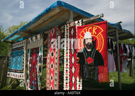 Kosovo, Pec. Roadside Souvenir stall selling rugs with UCK (Ushtria ...