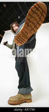 View of man s kicking boot from below Stock Photo - Alamy