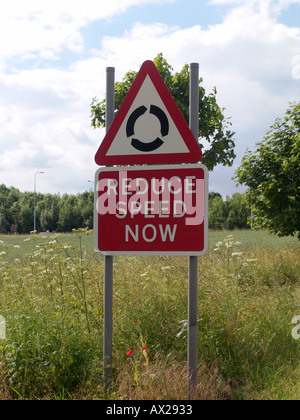Reduce speed now sign for roundabout in England. Showing traffic and ...