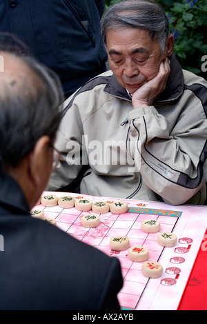 Hands of two players with chess pieces Stock Photo - Alamy