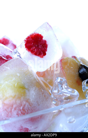 Frozen apricot and raspberries into a broken ice cubes Stock Photo - Alamy