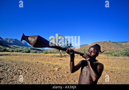 Young Himba or Ovahimba tribe man with traditional hairstyle braid of ...
