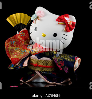 A fan of Japanese character Hello Kitty blows bubbles during a Hello ...
