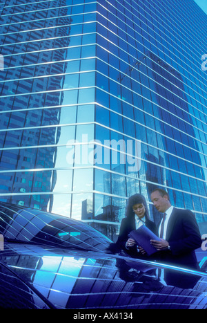 Tall glass business building in an urban city Stock Photo - Alamy