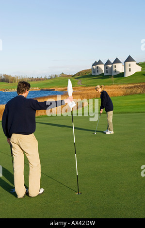 UK, Northern Ireland, Fermanagh. Playing golf on the new course ...