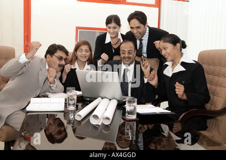 Formal Asian Business woman cheering success Stock Photo - Alamy
