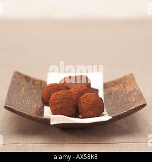 Chocolate truffles in a bowl close-up Stock Photo - Alamy