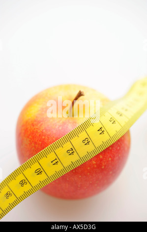 Red apple with measure tape Stock Photo - Alamy