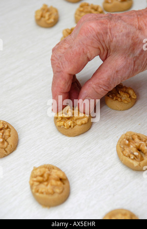 Old woman baking cookies Stock Photo - Alamy