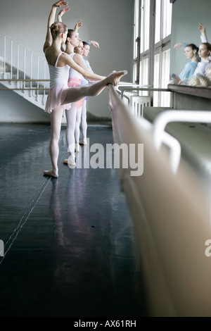 Female ballet dancers doing exercising at the ballet bare Stock Photo ...