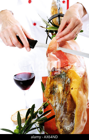 red ham cut by hand chef professional cutter carving slices from whole ...