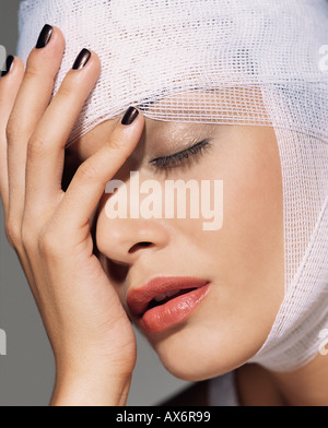beauty woman with bandage around head Stock Photo - Alamy