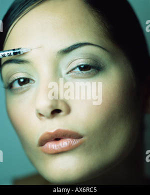 Attractive woman having botox injection Stock Photo - Alamy