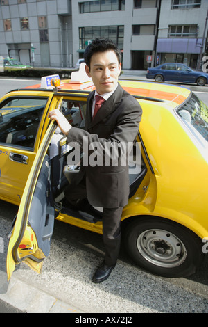 Man is stepping out of car, portrait Stock Photo - Alamy
