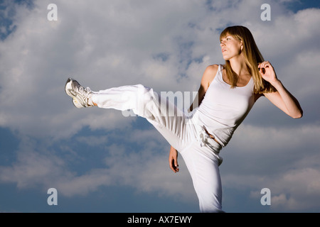 Woman Kicking off her shoes Stock Photo - Alamy