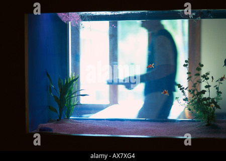 View through an aquarium at a waitress, Restaurant Cavall Bernat, Hotel ...