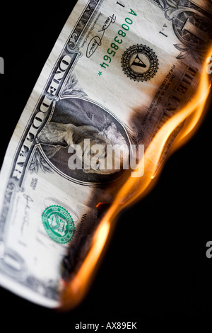 American dollar bill burning concept Stock Photo - Alamy