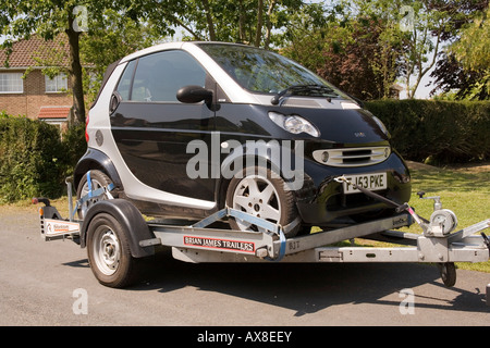 Motorhome towing a Smart car on a trailer on an Autoroute in France ...